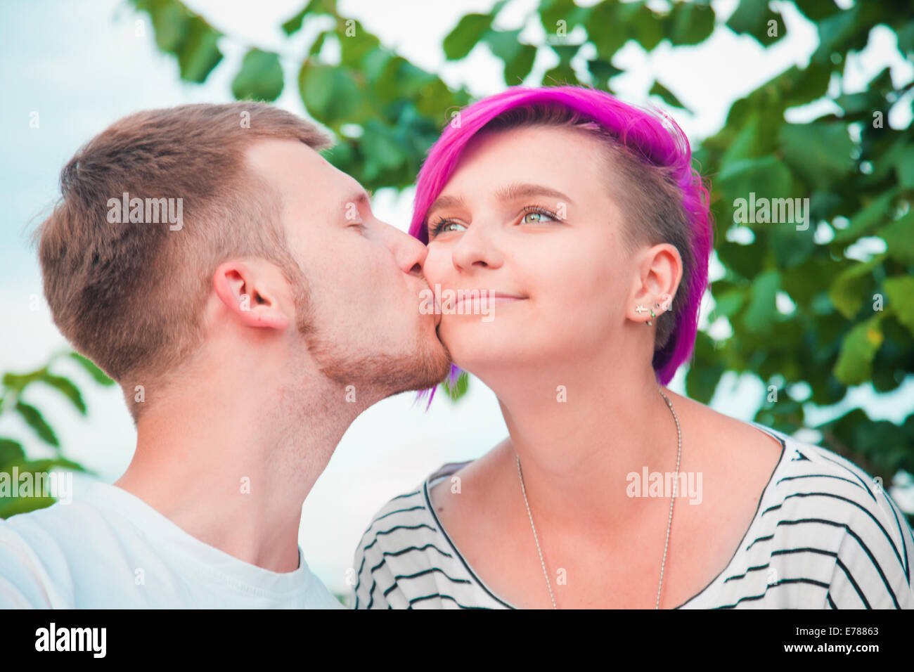 Close up of a young couple kissing Stock Photo - Alamy