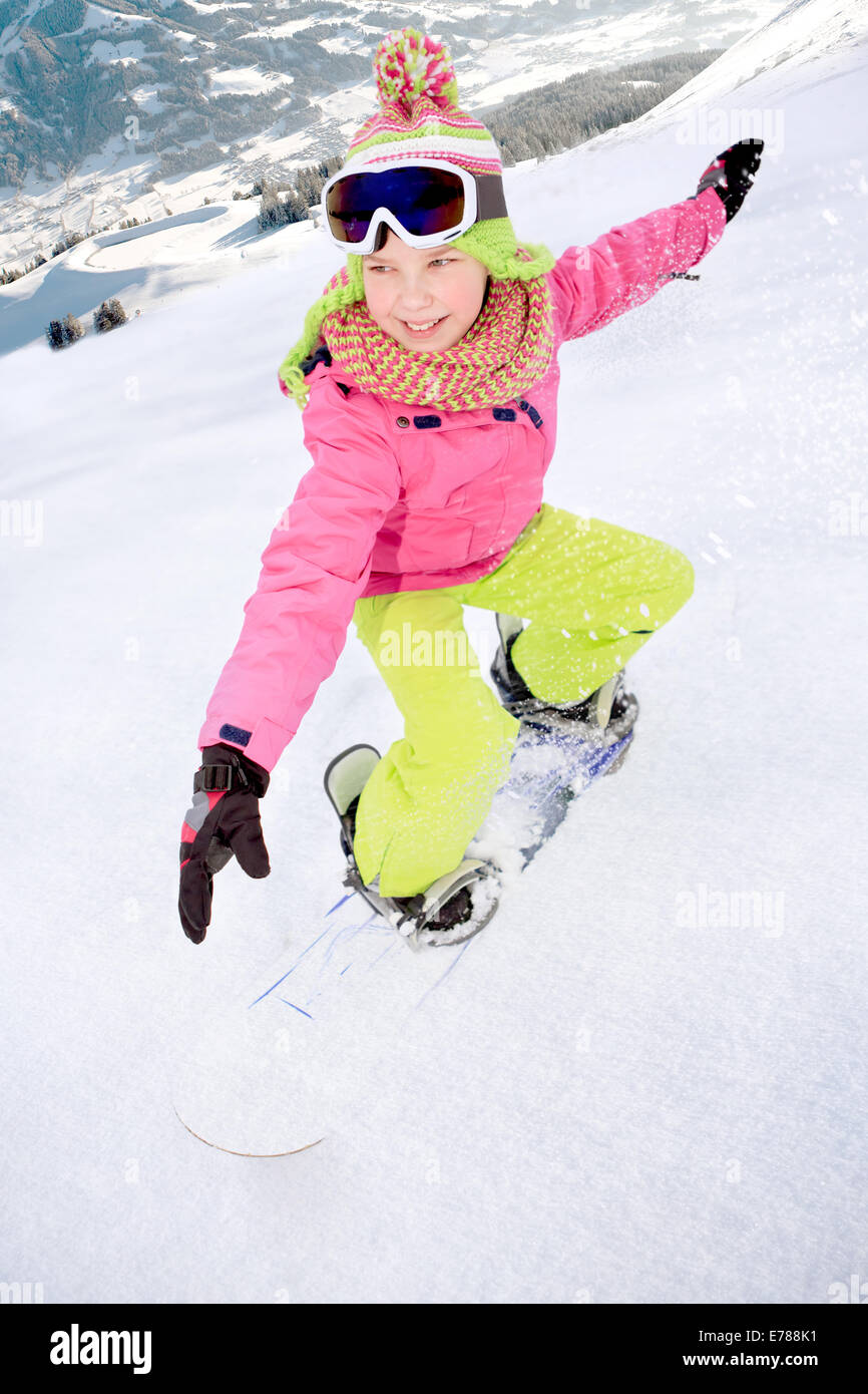 a teenage girl snowboarding in the Alps Stock Photo - Alamy