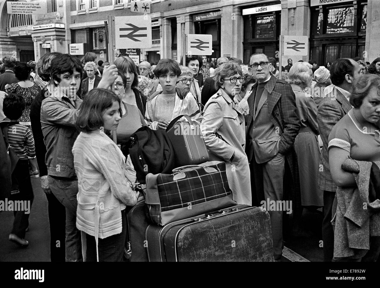 Passengers waiting for a delayed train, Waterloo station, London ...