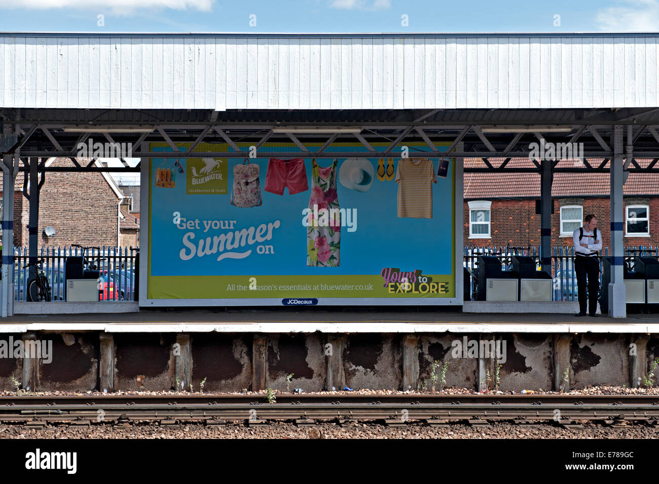 Summer advertising poster on and English Railway Station platform Stock ...