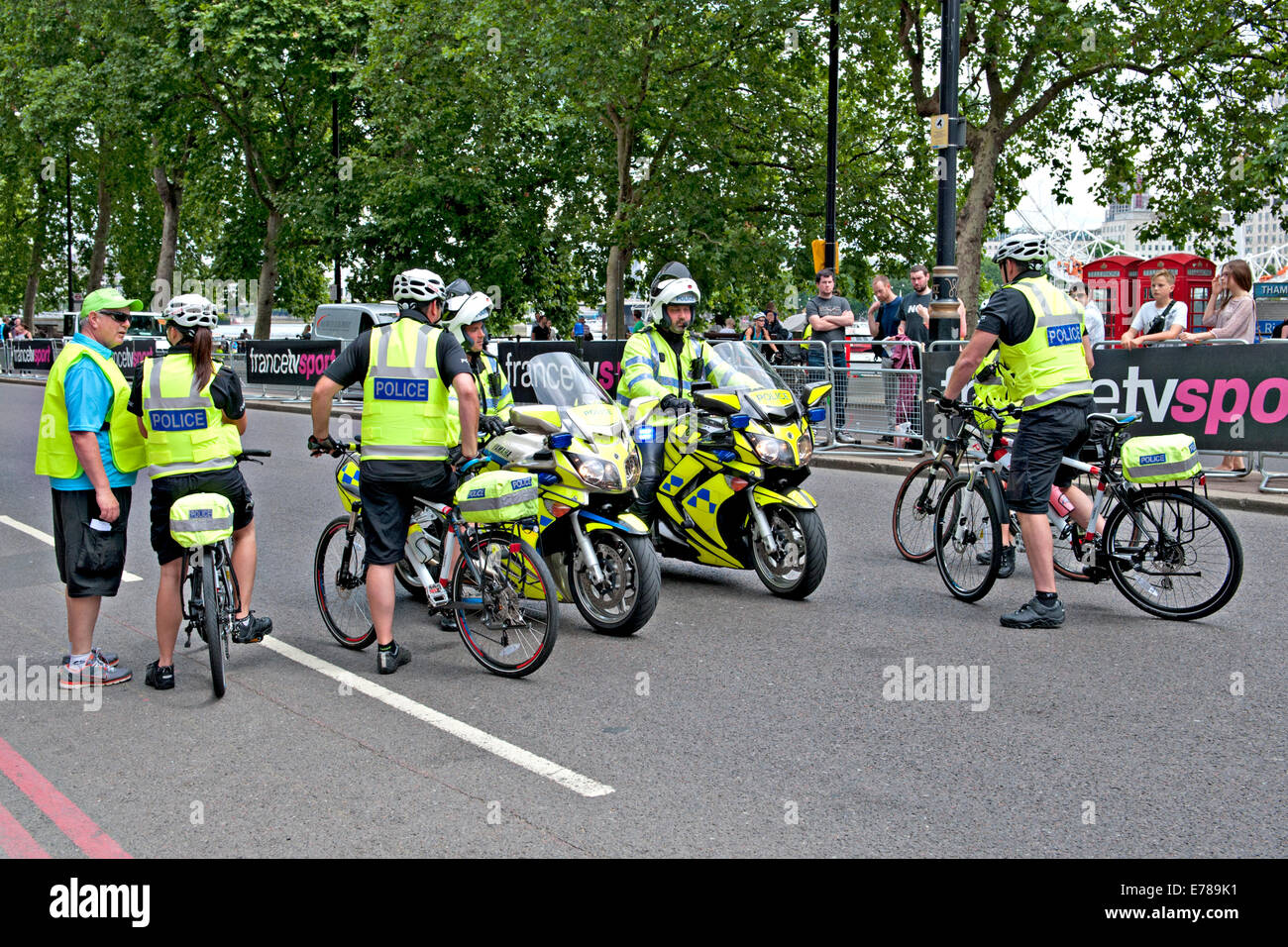 Police motorcyclists and cyclists ahead of the 2014 Tour de France ...