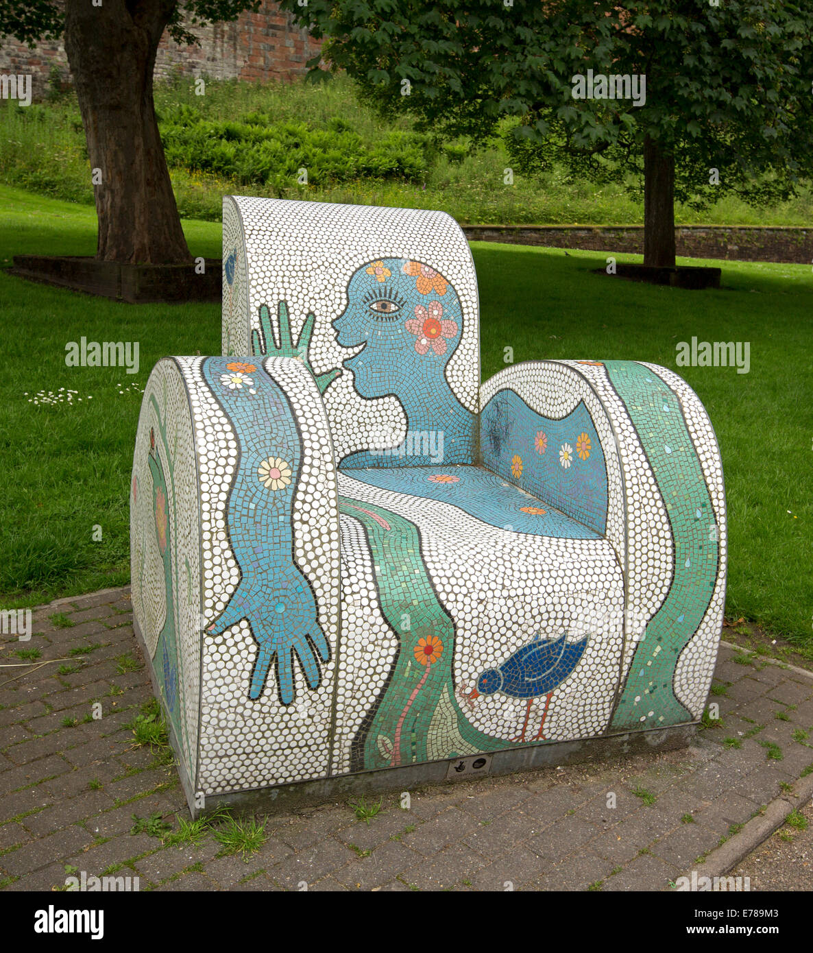 Street art, seating in public park, arm chair created with colourful ...