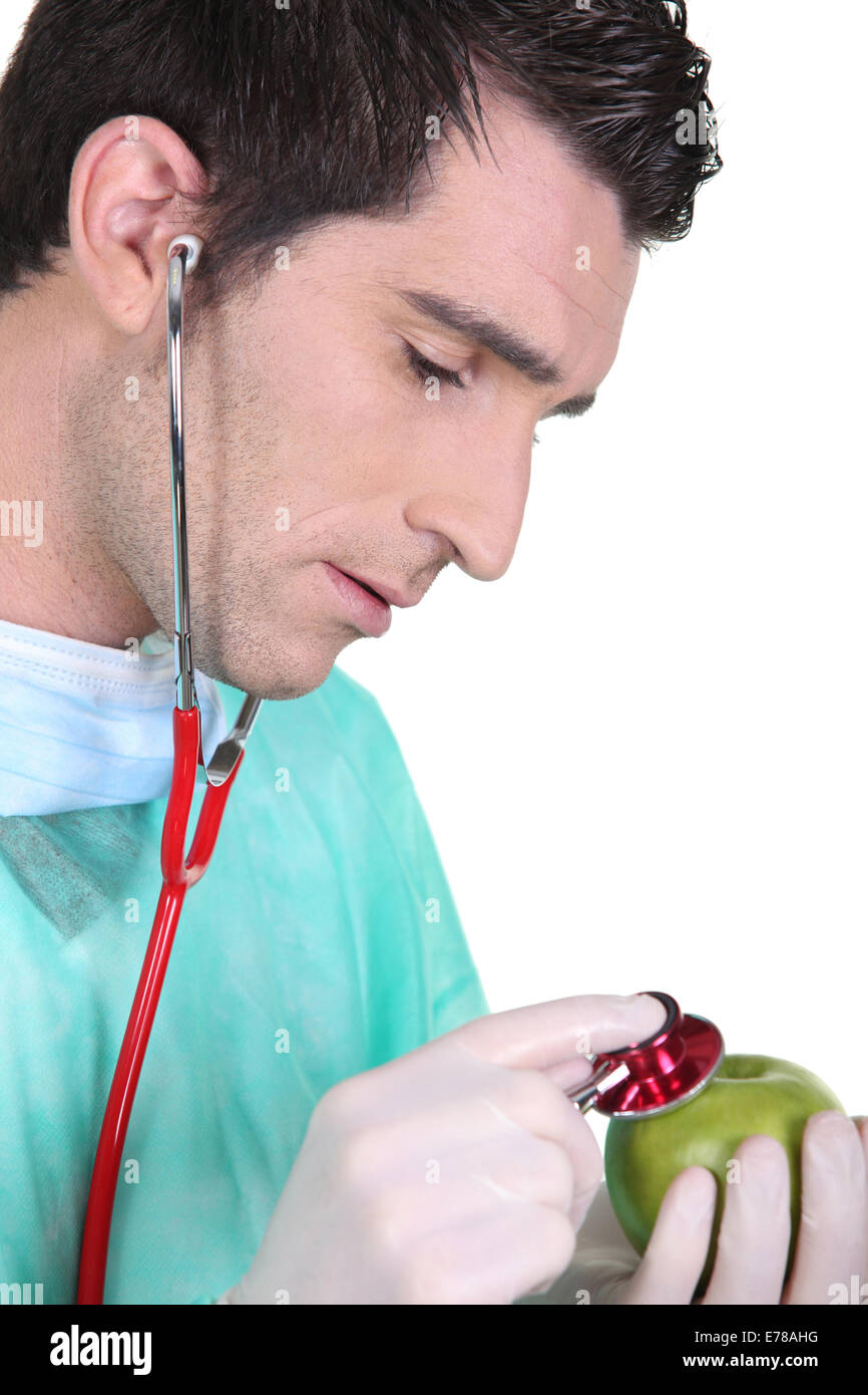 Doctor using stethoscope Stock Photo - Alamy