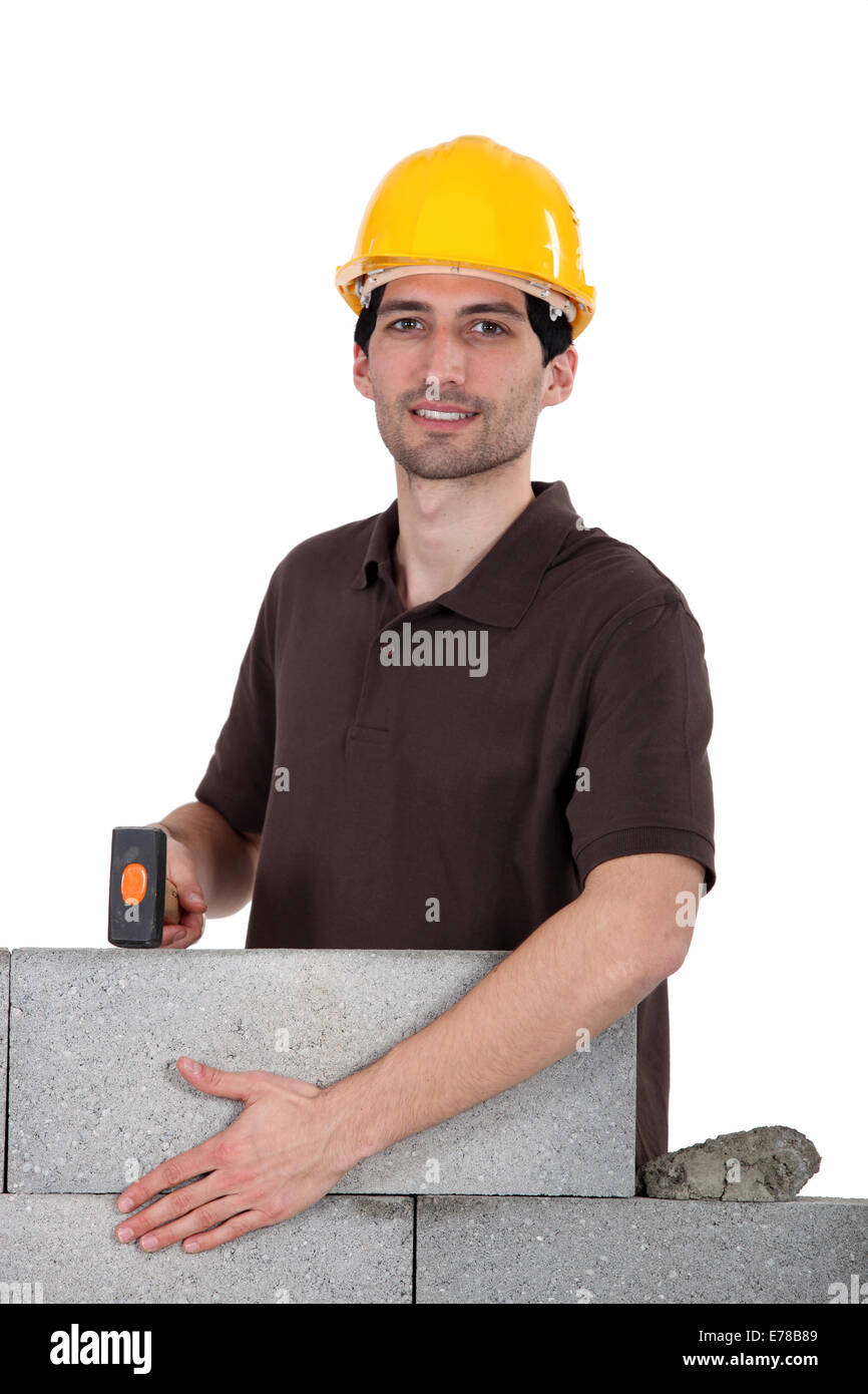 Bricklayer laying blocks hi-res stock photography and images - Alamy