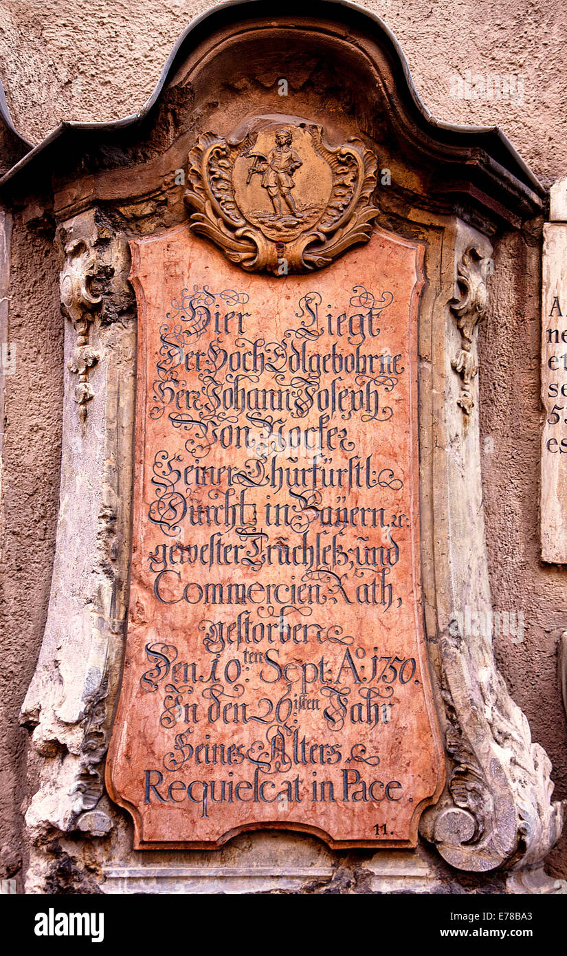 Antique tombstone in old German and Latin surmounted by an emblem in ...