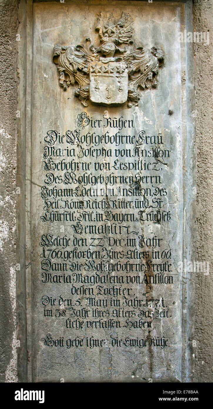 Antique tombstone in old German surmounted by an emblem Stock Photo - Alamy