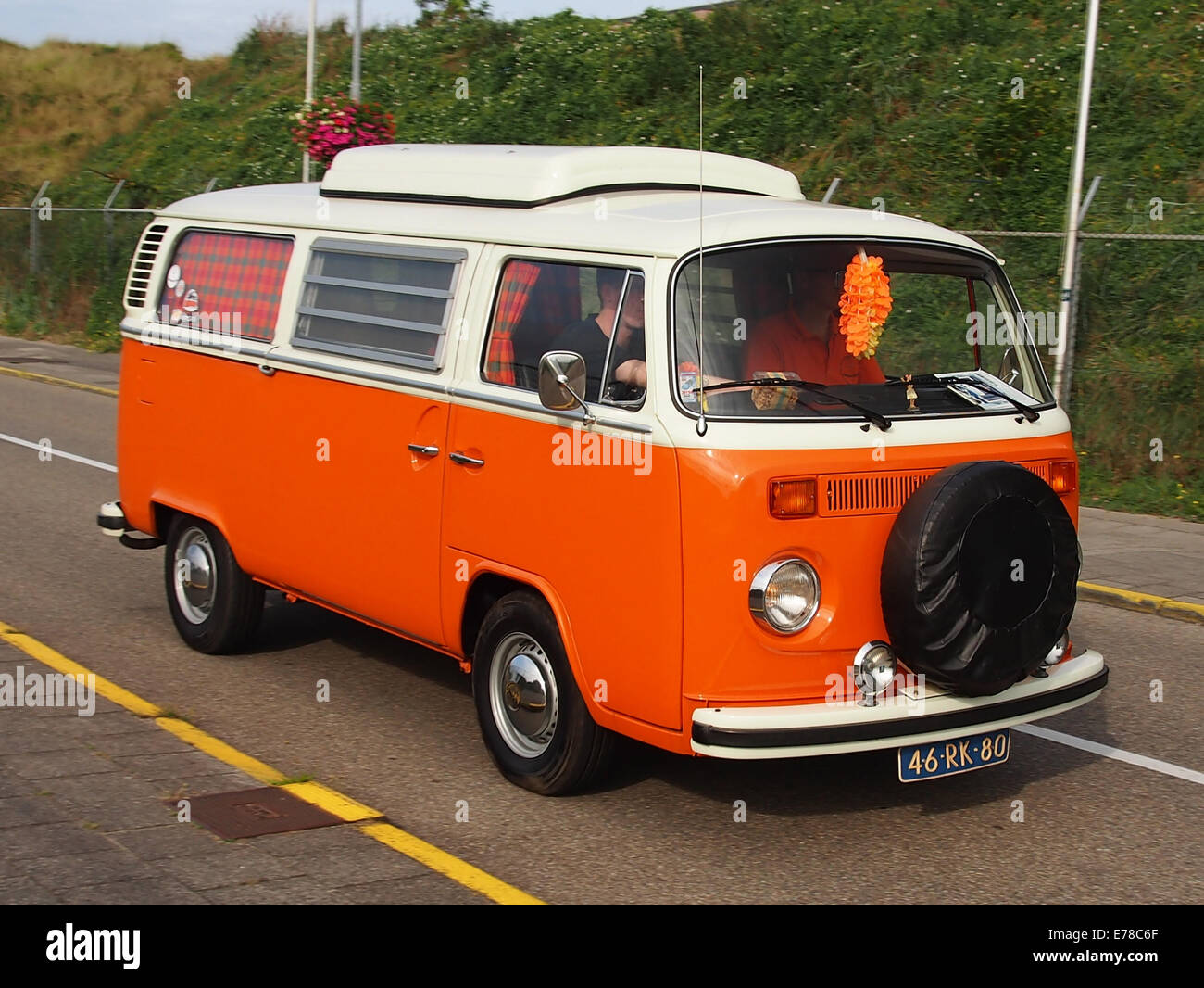 This image features a Volkswagen 24 bus, a classic German vehicle, with ...