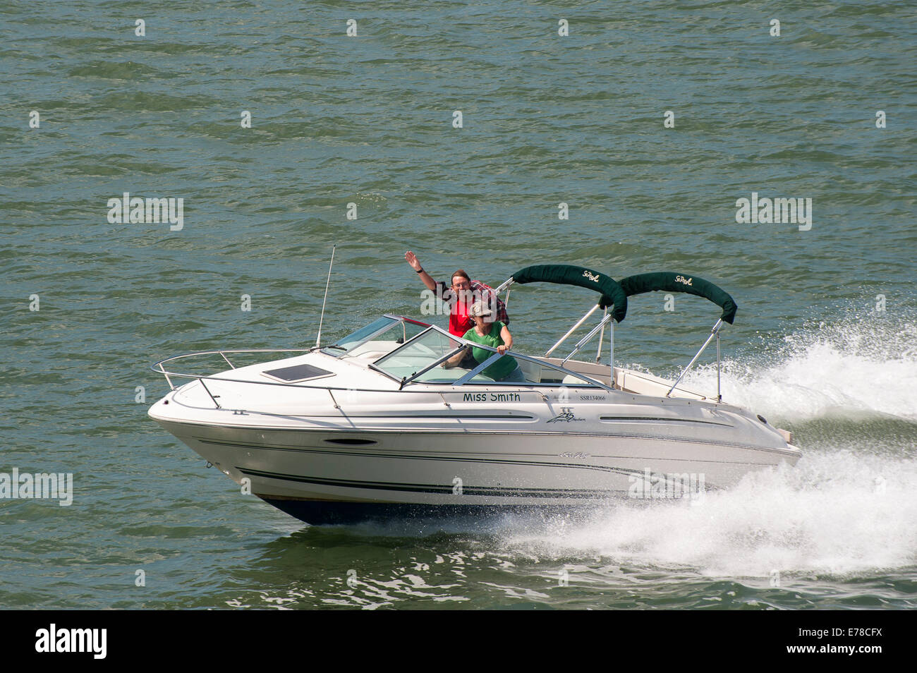 Couple enjoying an afternoon out in a speedboat Stock Photo - Alamy