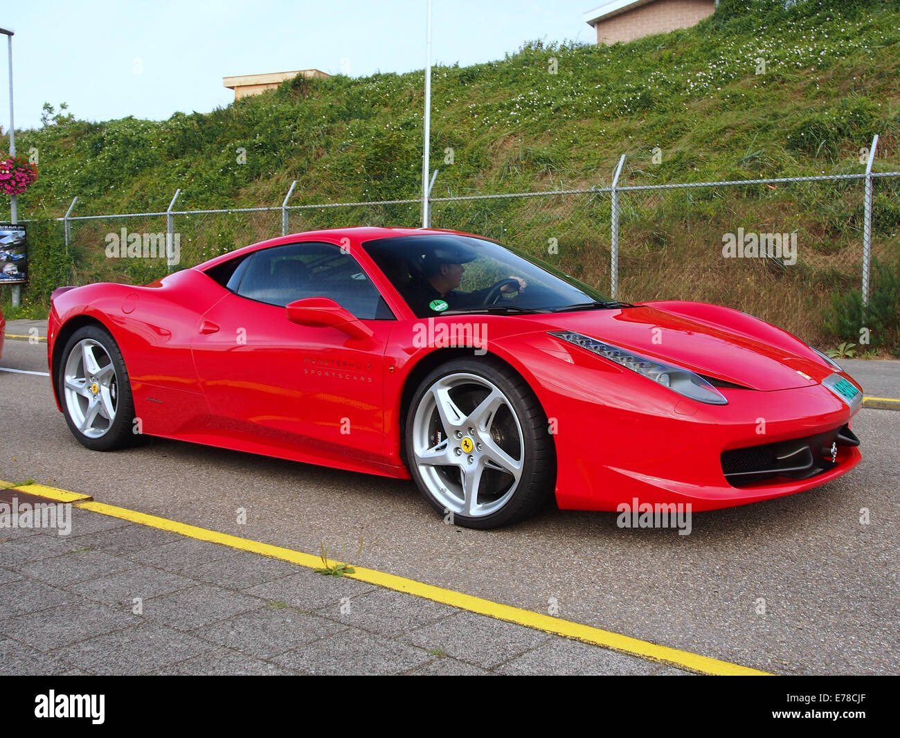 A red Ferrari 458 Spider is shown, highlighting the car's distinctive ...