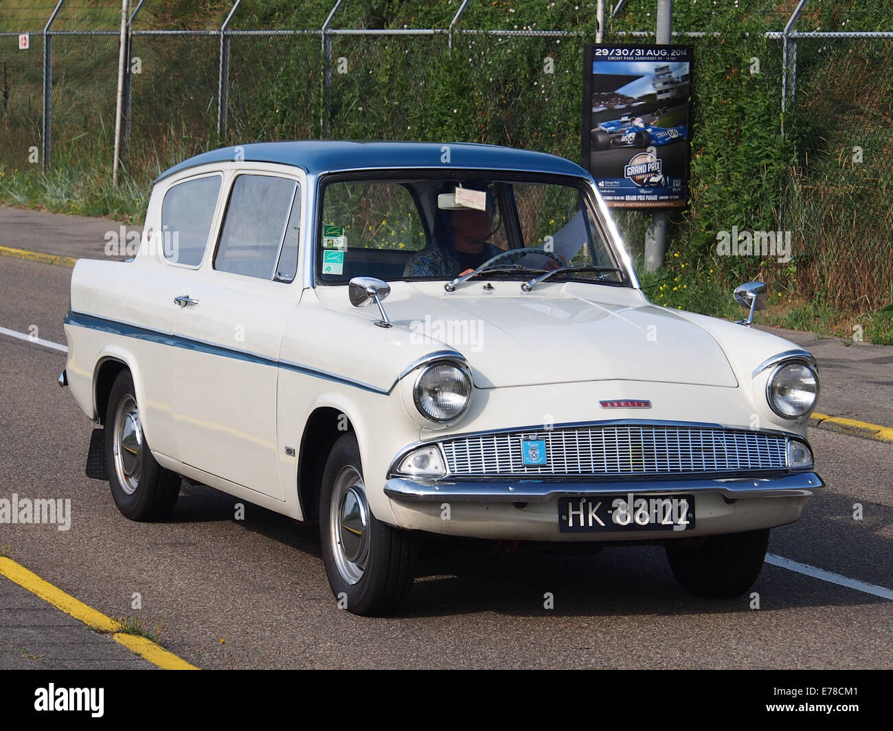 This image features a 1962 Ford Anglia, a compact British car known for ...