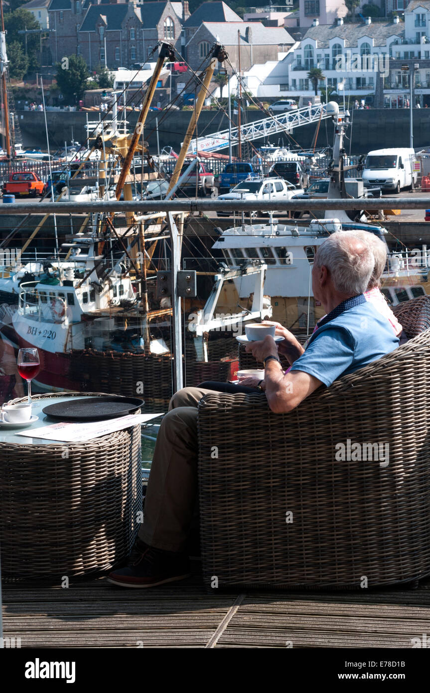 diners view Brixham fishing fleet in Brixham harbour Stock Photo - Alamy