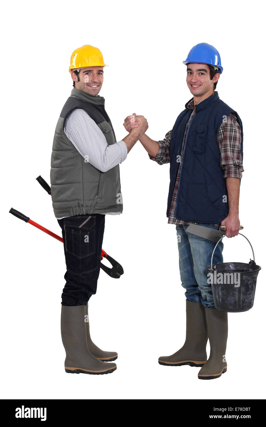 Construction workers greeting each other Stock Photo - Alamy