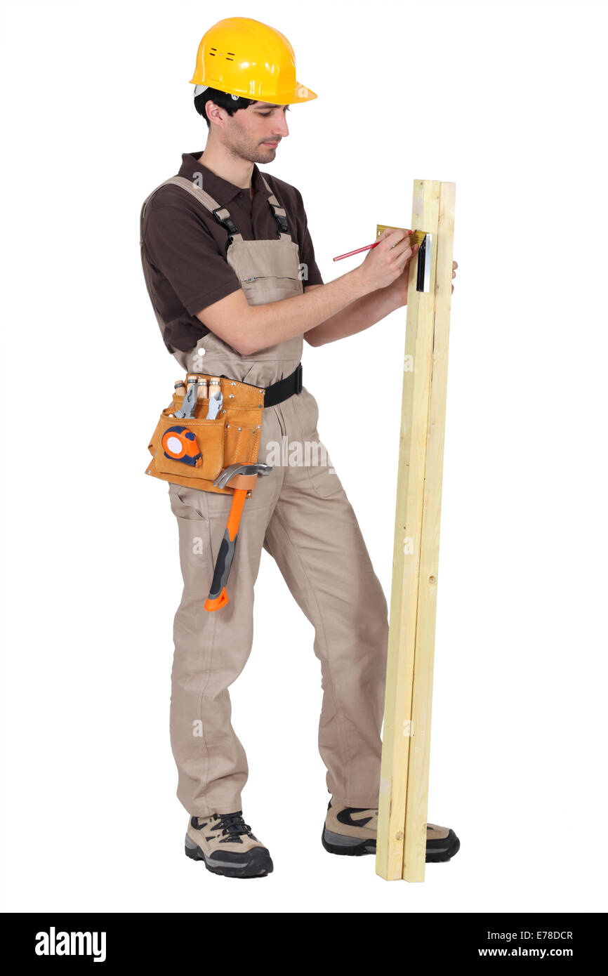 Tradesman using a try square to measure an angle Stock Photo - Alamy