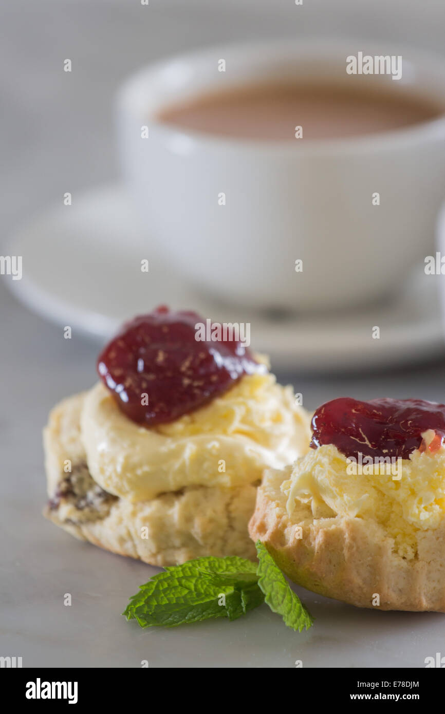 Cream tea served open with mint garnish Stock Photo - Alamy