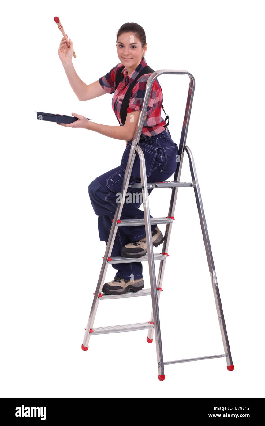 female painter on ladder against white background Stock Photo - Alamy
