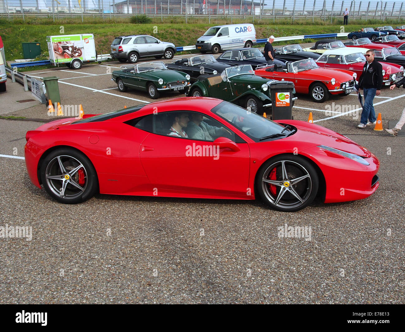 The Red Ferrari 458 Spider is a luxury sports car renowned for its high ...