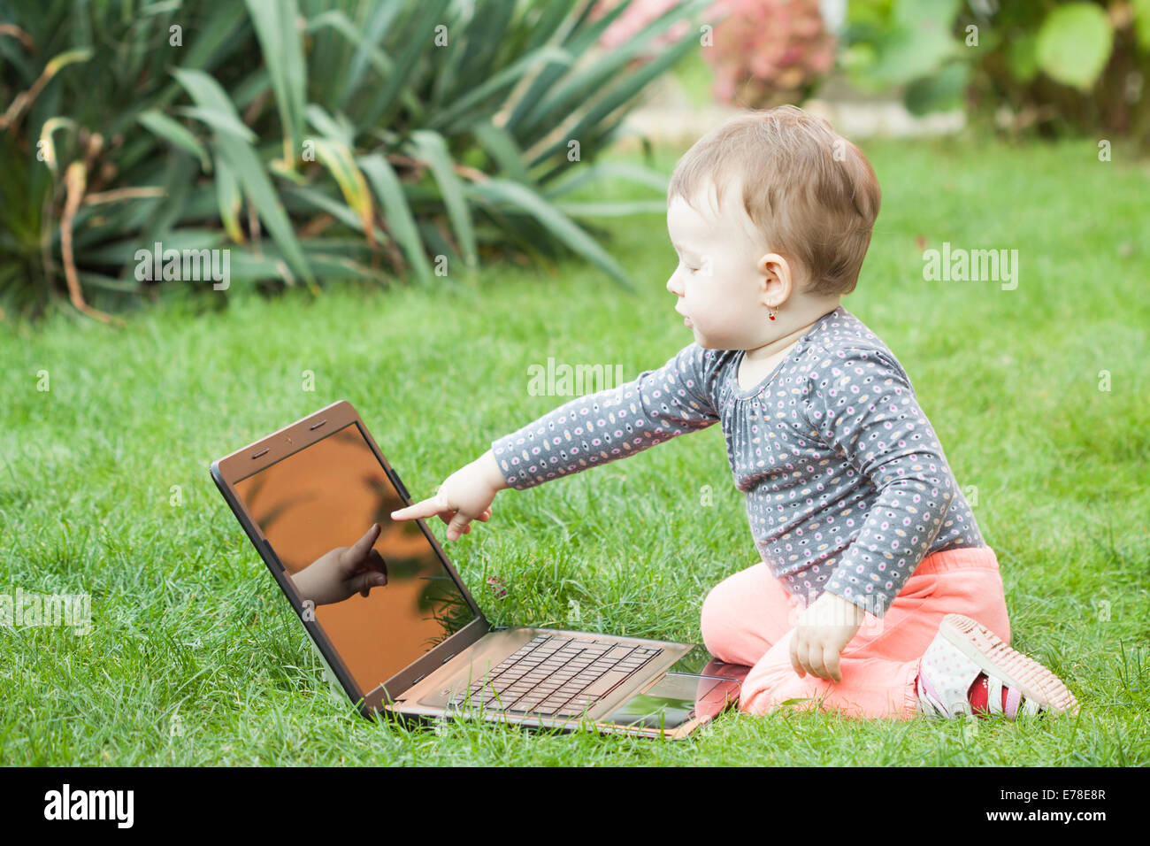Kid laptop outdoor hi-res stock photography and images - Alamy