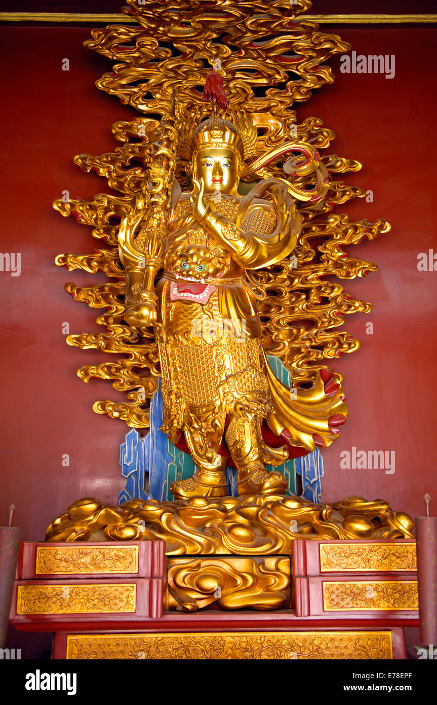 A gold figurine in the Lama Temple of Beijing Stock Photo - Alamy