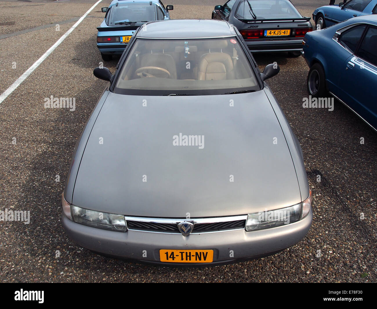 The 1990 EUNOS COSMO, license 14-TH-NV, is a luxury sports car ...