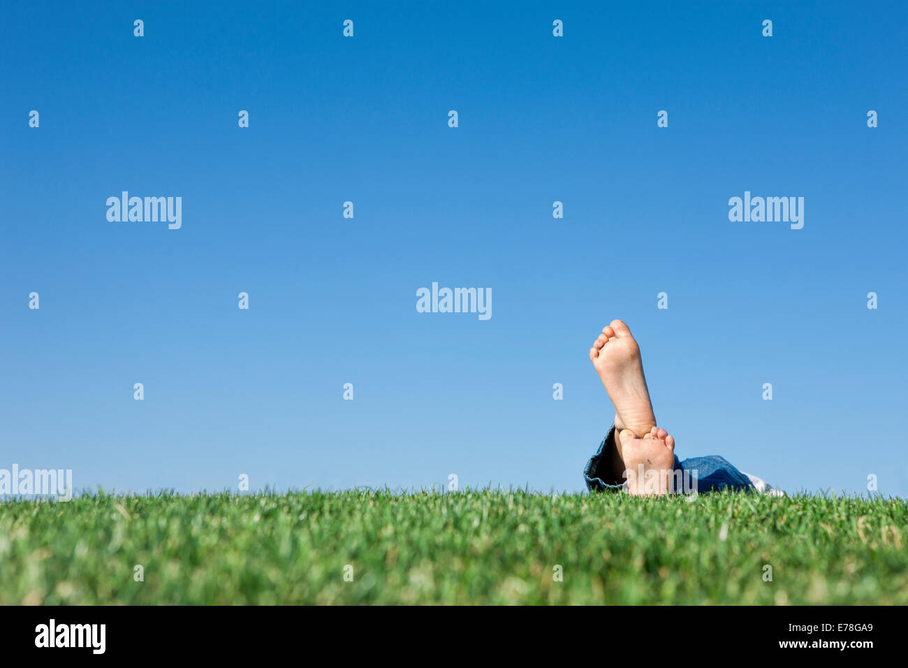 Feet, grass, sky Stock Photo - Alamy