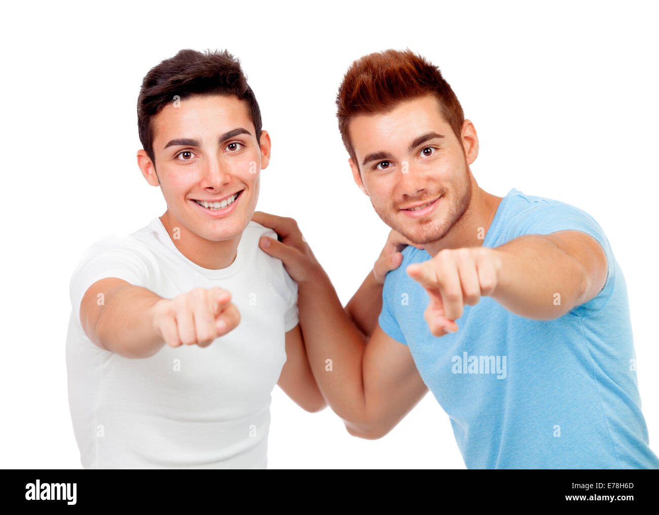 Couple of best friends pointing to the front isolated on a white ...