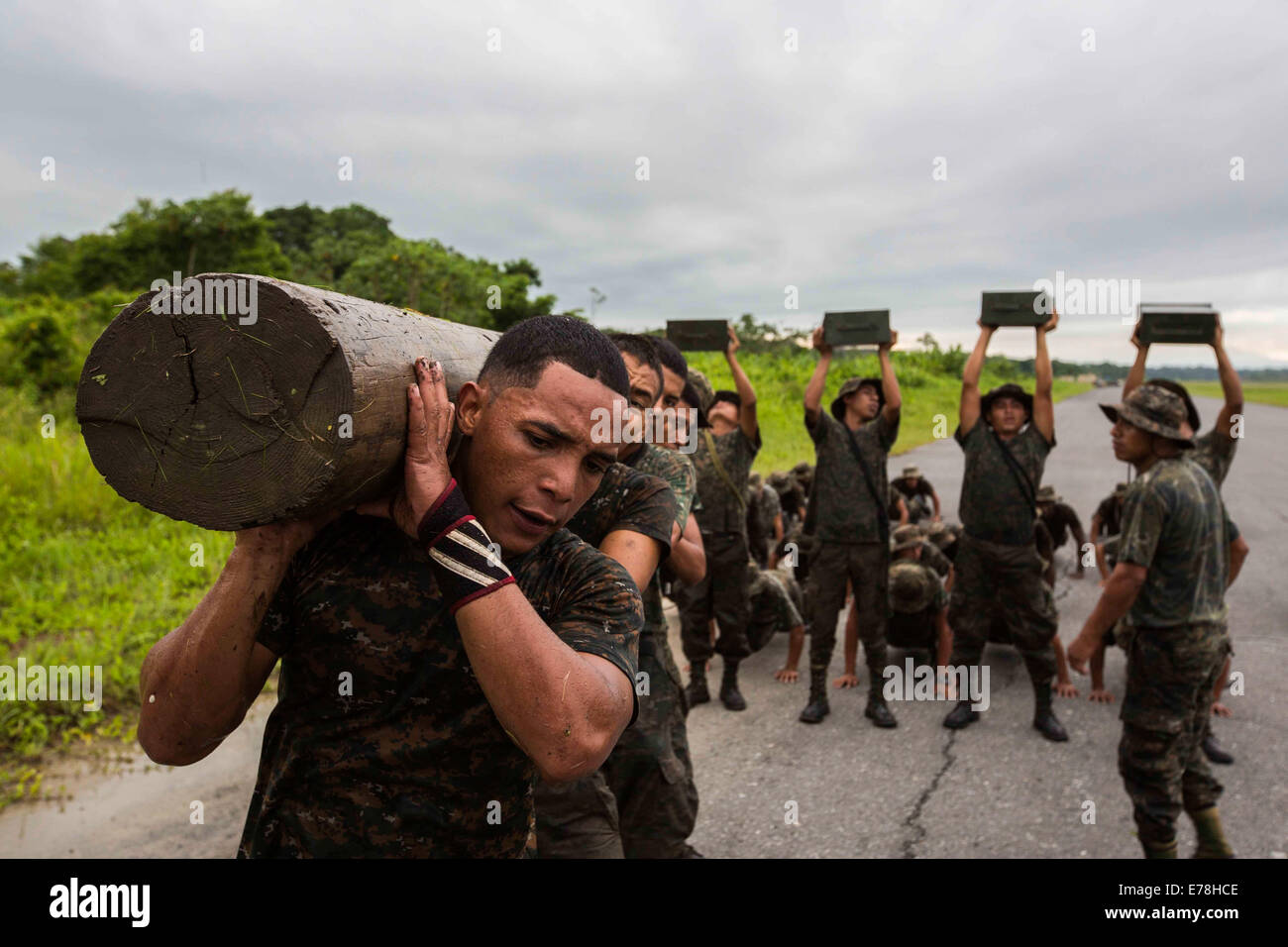 Guatemalan marines assigned to the Marine Brigade carry a log while ...