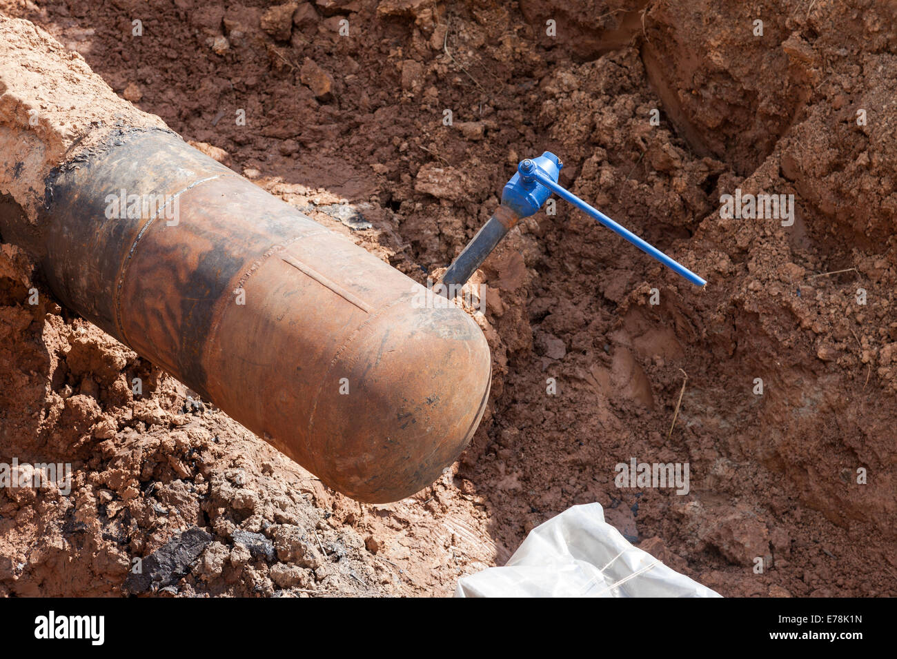 Repair of the underground pipeline in trench Stock Photo - Alamy