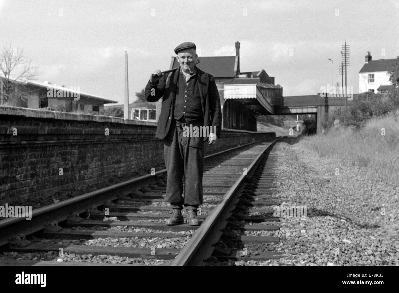 elderly british rail employee walking along the great central line ...
