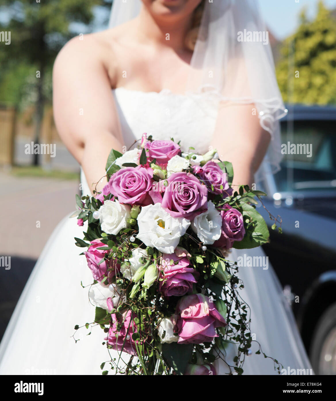 Bride with bridal bouquet white roses, no face Stock Photo - Alamy