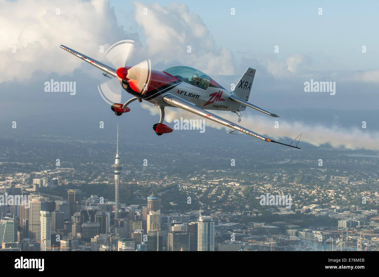 Extra Aircraft Extra 300 in flight over Auckland Stock Photo - Alamy