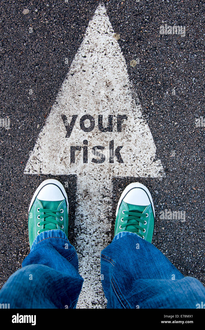 Green shoes standing on your risk sign Stock Photo - Alamy