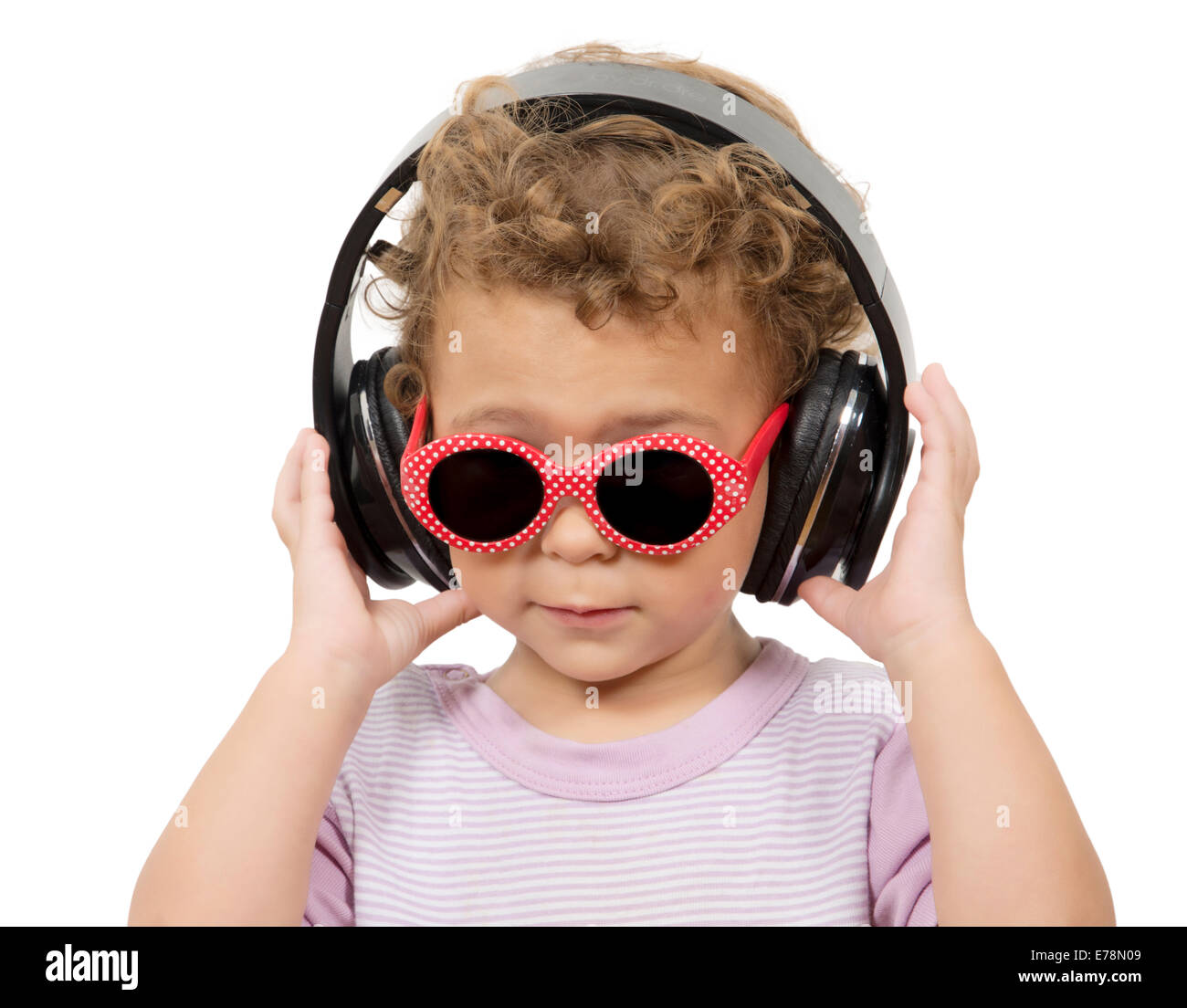 Beautiful cute happy little girl with headphones Stock Photo - Alamy