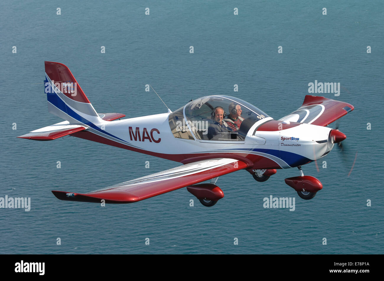 SportStar light aircraft in flight over water Stock Photo - Alamy