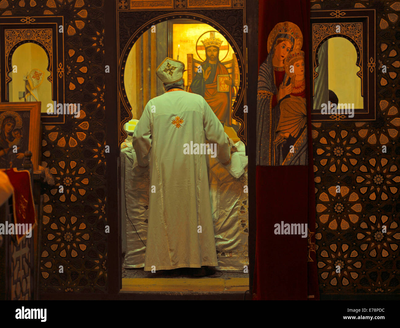 A Priest before the altar in the Hanging Church Al-Muallaqa in Cairo ...