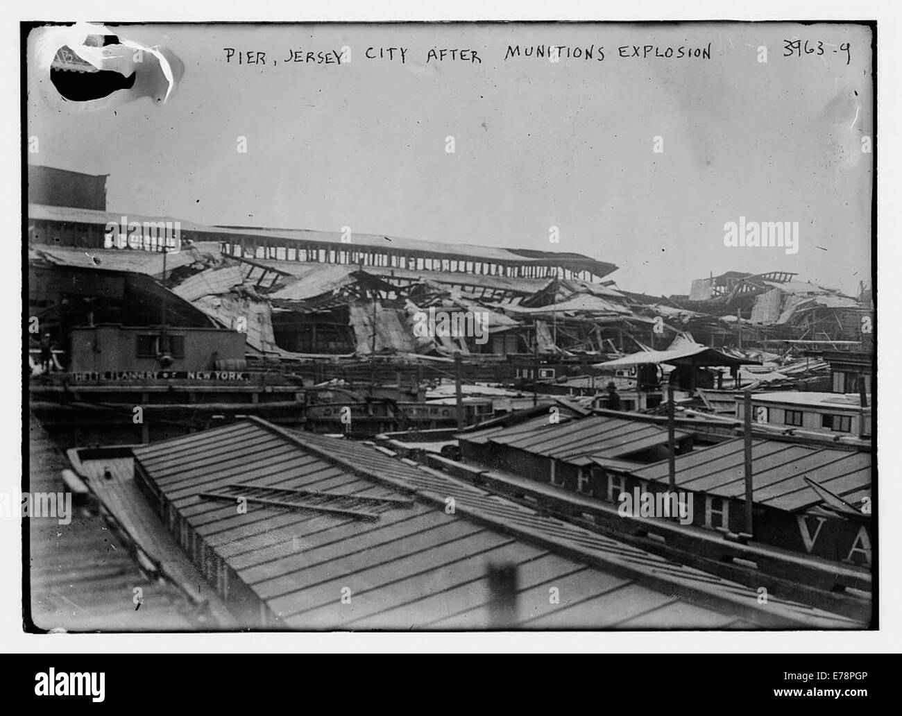 This photograph depicts the aftermath of a munitions explosion at a ...