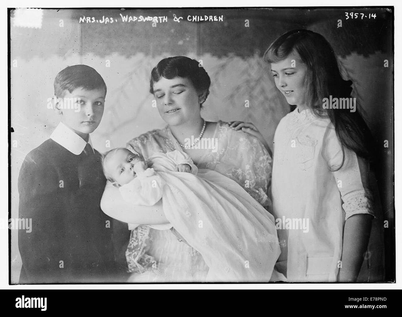 This photograph captures Mrs. Jas Wadsworth with her children, offering ...
