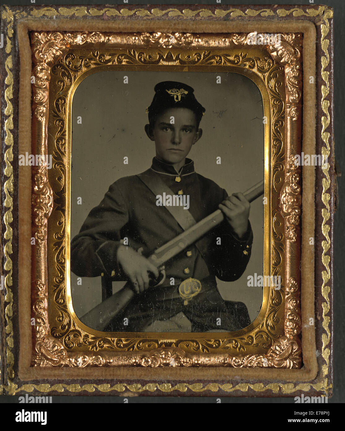 This historical image captures a young soldier in a Union uniform ...