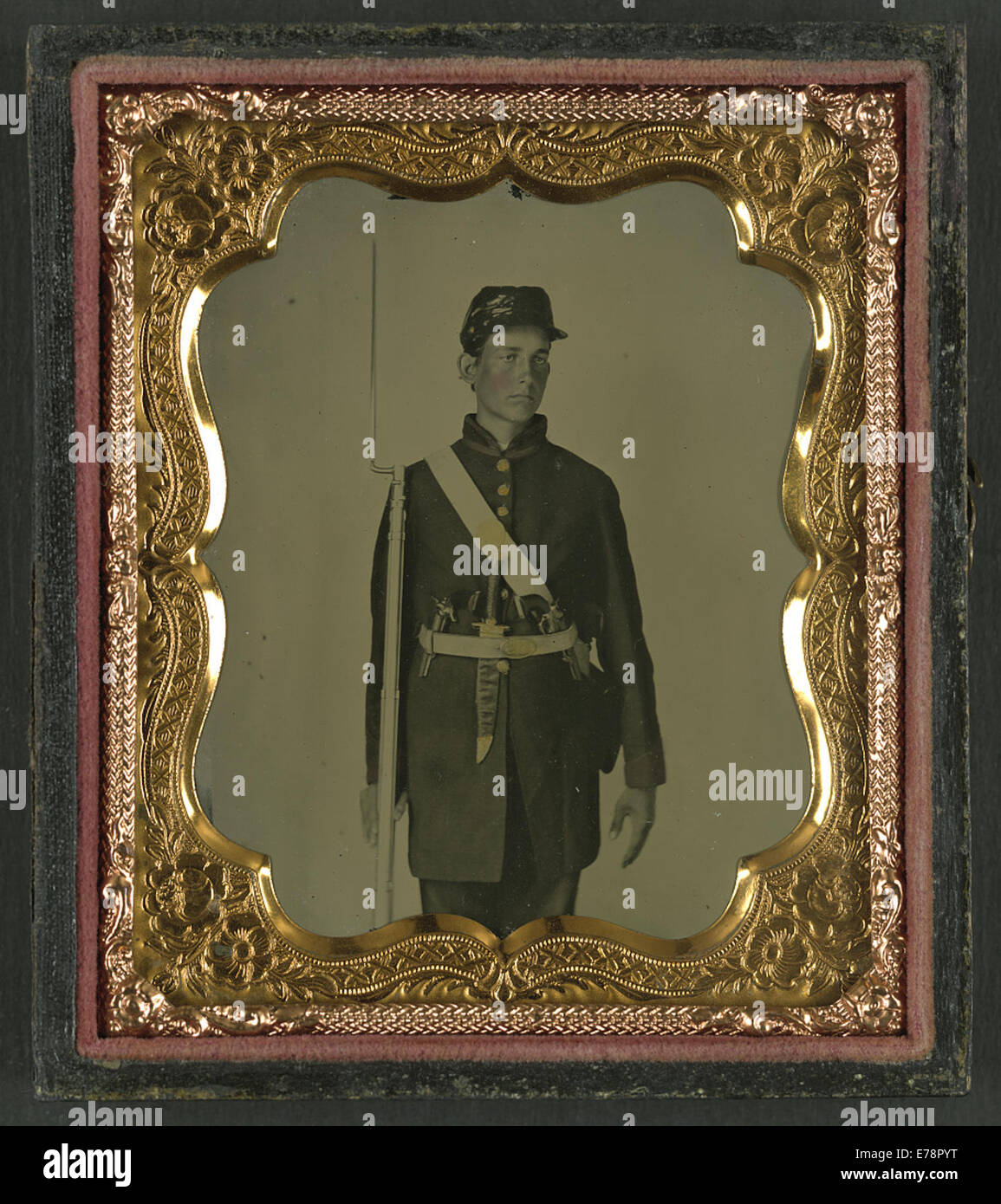 This image shows an unidentified soldier in a Union uniform holding a ...