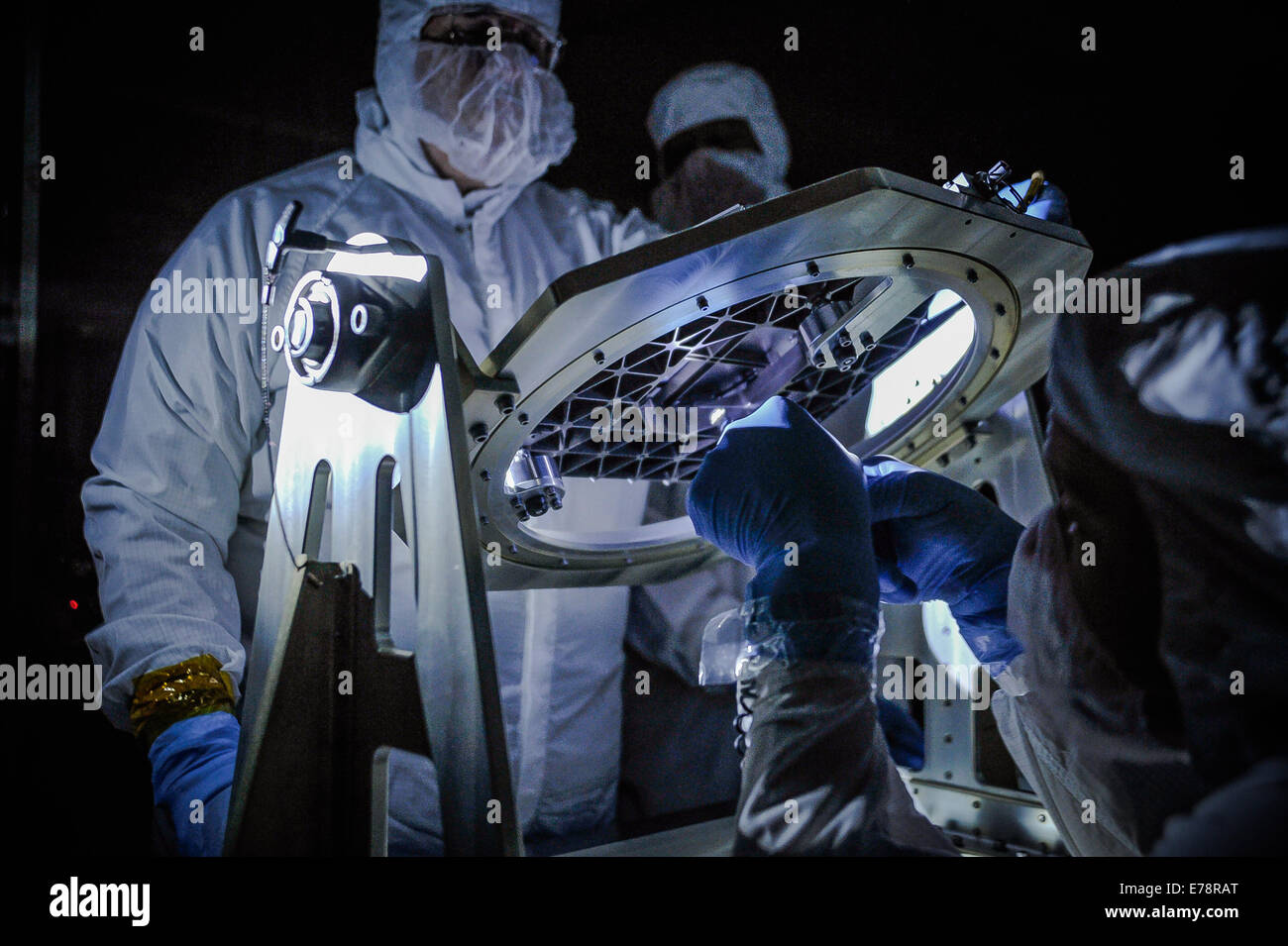 NASA engineers inspect the micro shutter array developed for the James ...