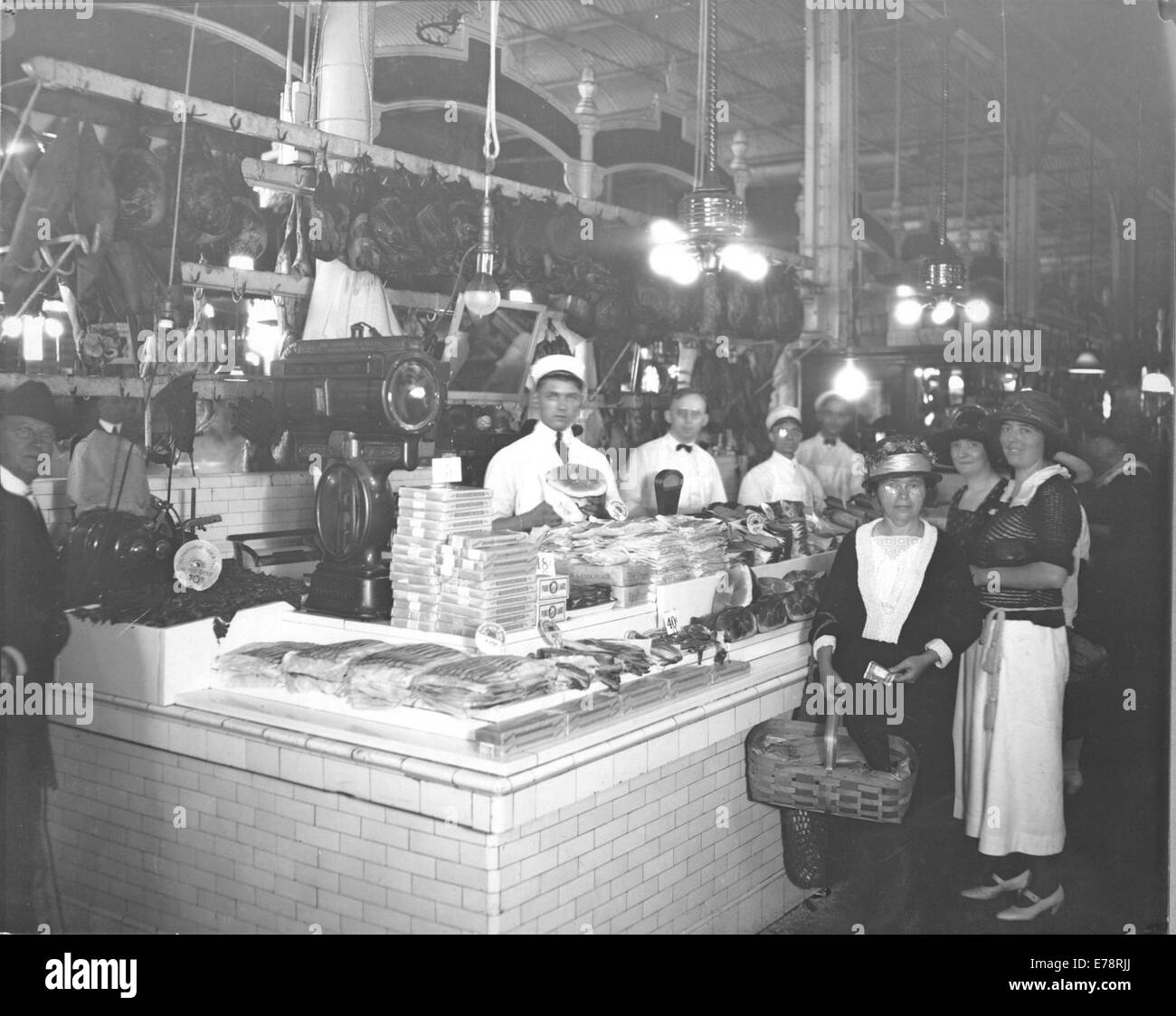 A photograph showcasing an appealing display of cured meats in a center ...