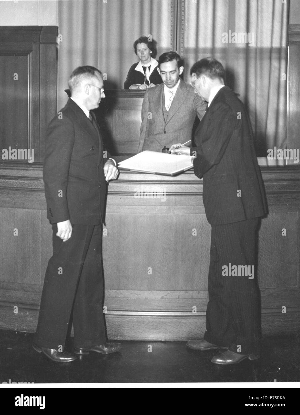 A historical photograph of Colonel Oliver H. Spaulding signing ...