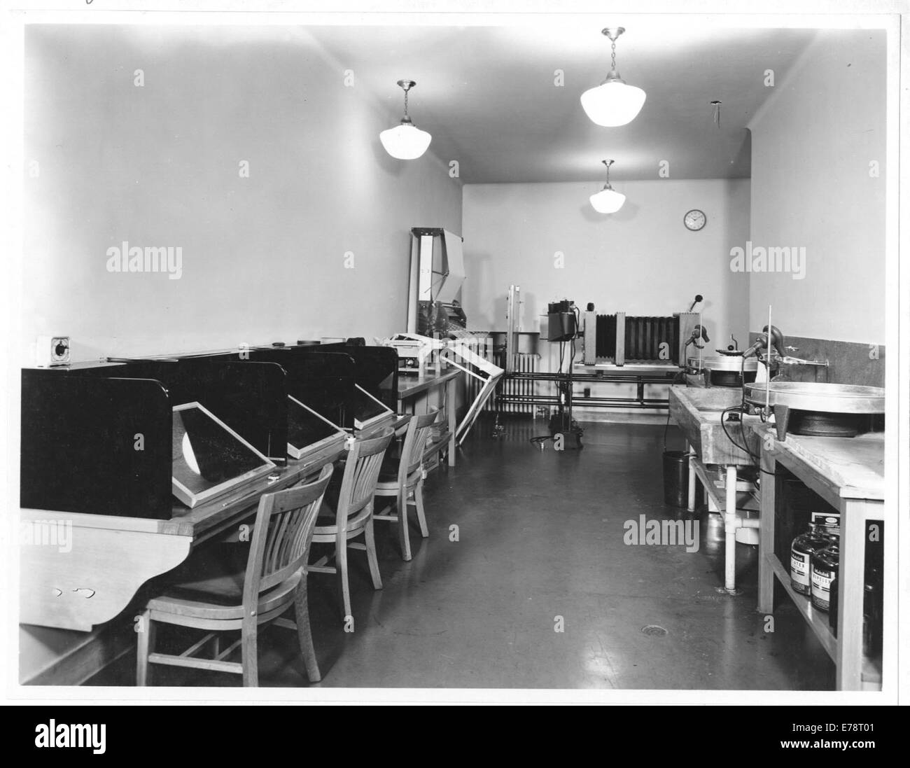 This photograph depicts opaquing tables at the Division of Photographic ...