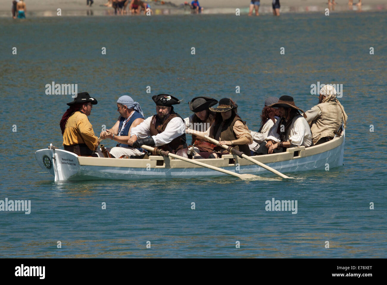 Pirates in traditional costume in a row boat entertain visitors at the ...