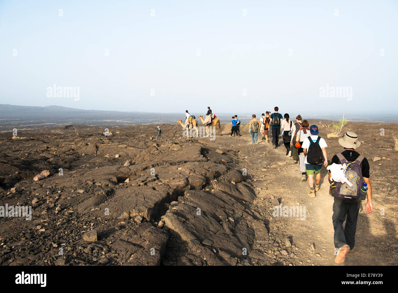 Tourist hiking down from the Erta Ale volcano after camping out at ...