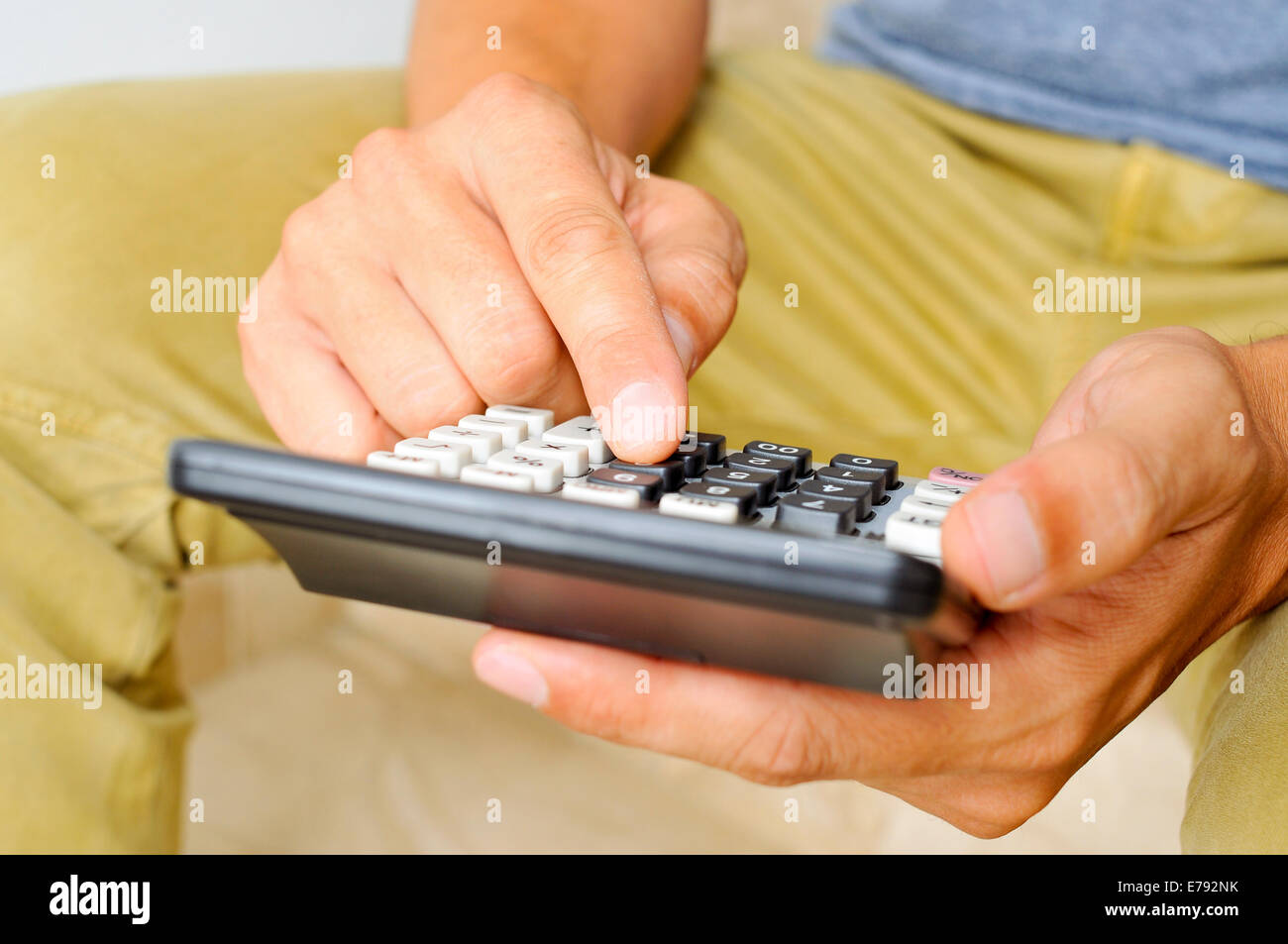 Using a calculator hi-res stock photography and images - Alamy