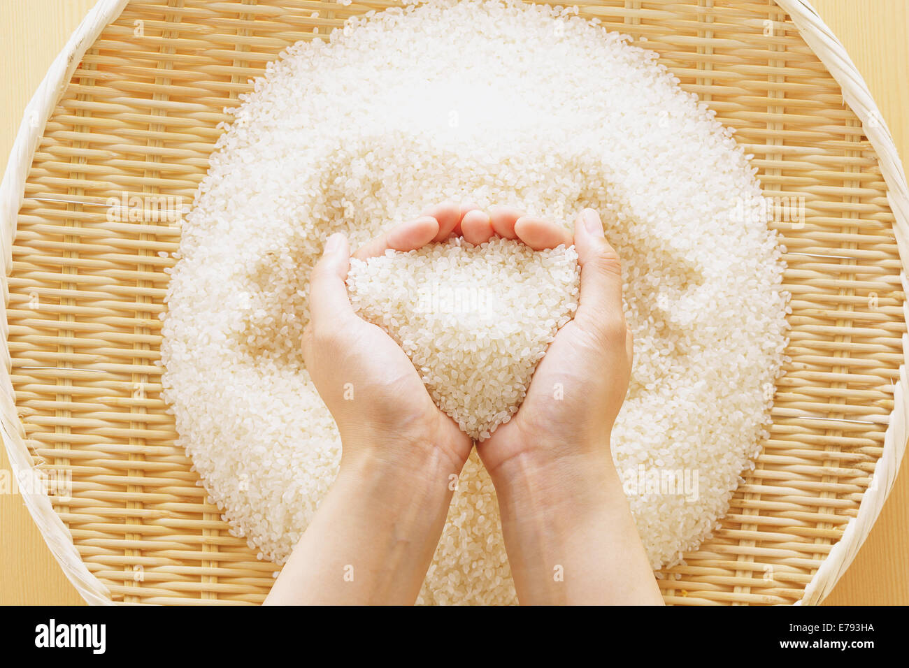 Young Japanese woman holding rice in her hands Stock Photo - Alamy