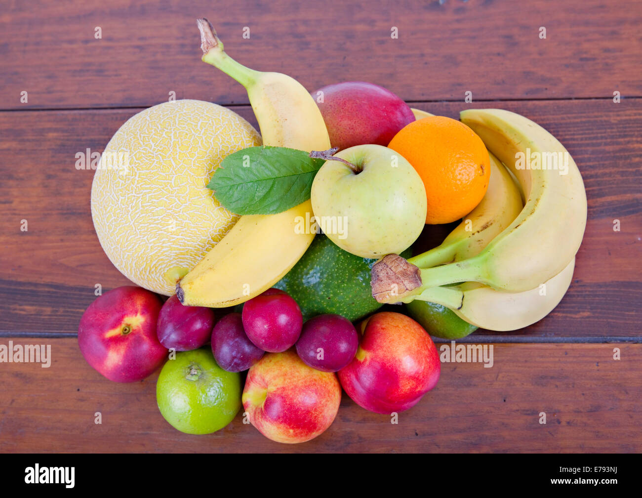 set of fruits on wooden table Stock Photo - Alamy