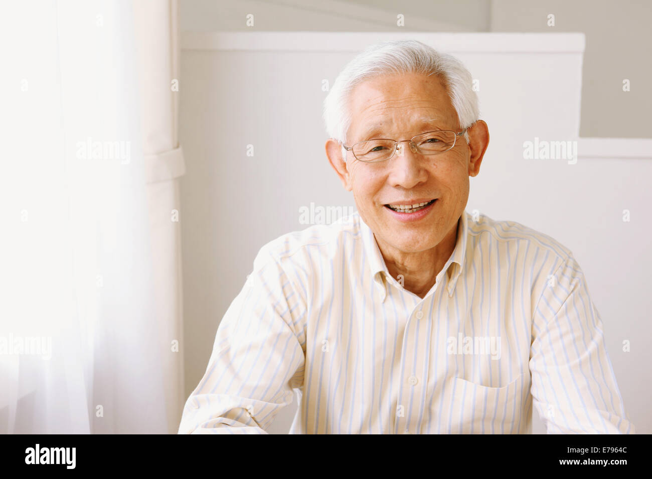 Senior adult Japanese man smiling Stock Photo - Alamy