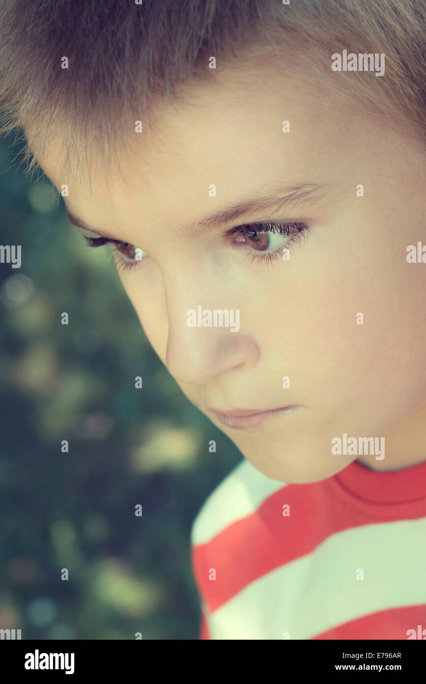 Boy looking down, close up portrait Stock Photo - Alamy