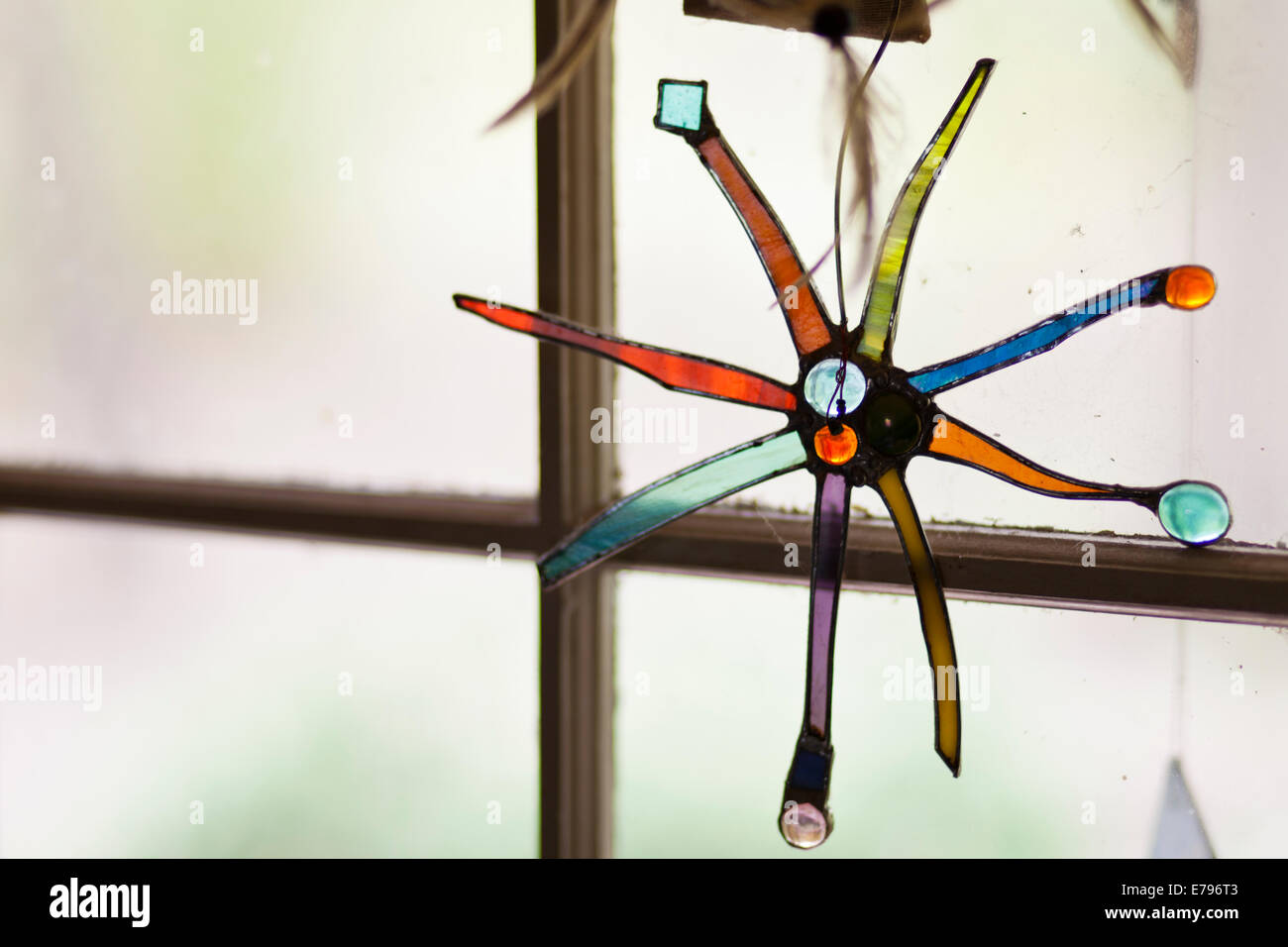 Glass decoration in a window Stock Photo - Alamy